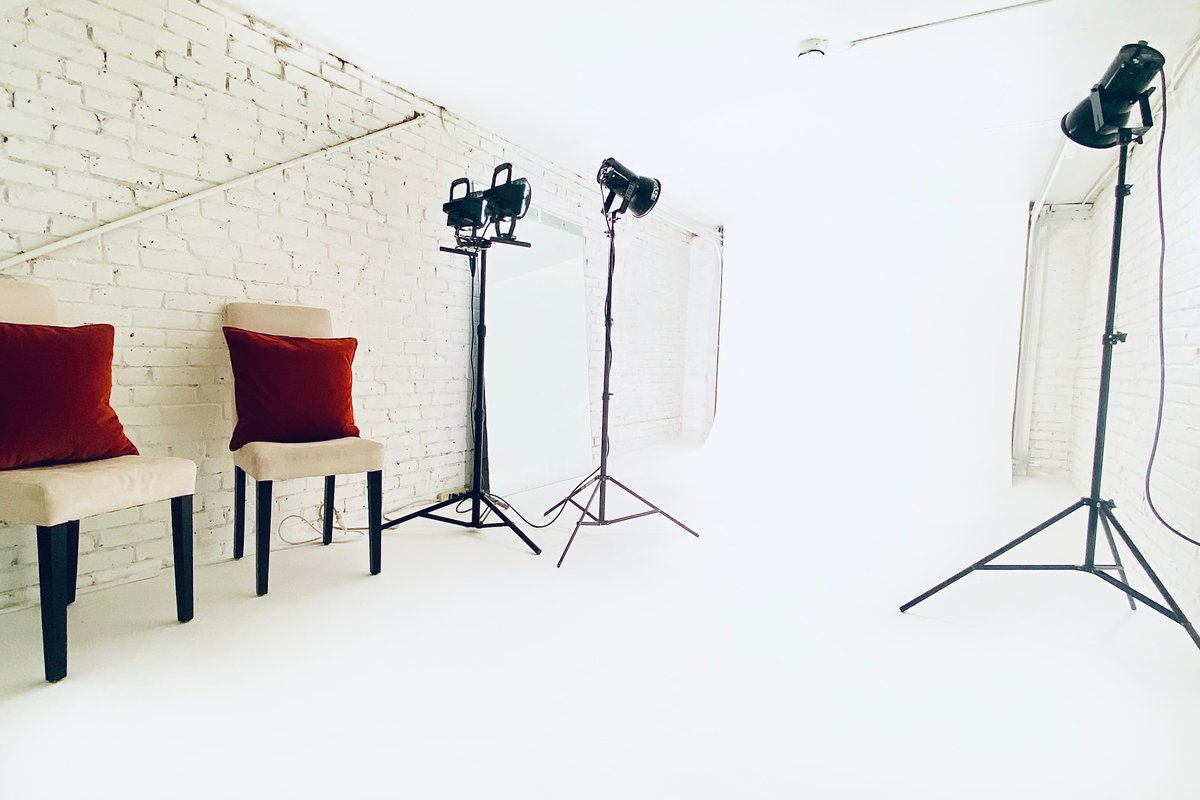 All white brick studio with cyclorama wall | Storefront